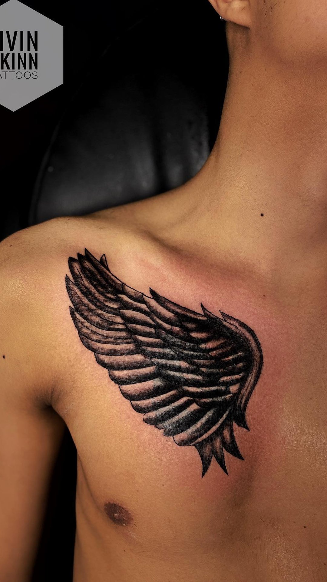 Angelic Blackwork Wing Across the Chest - Tattoos.com