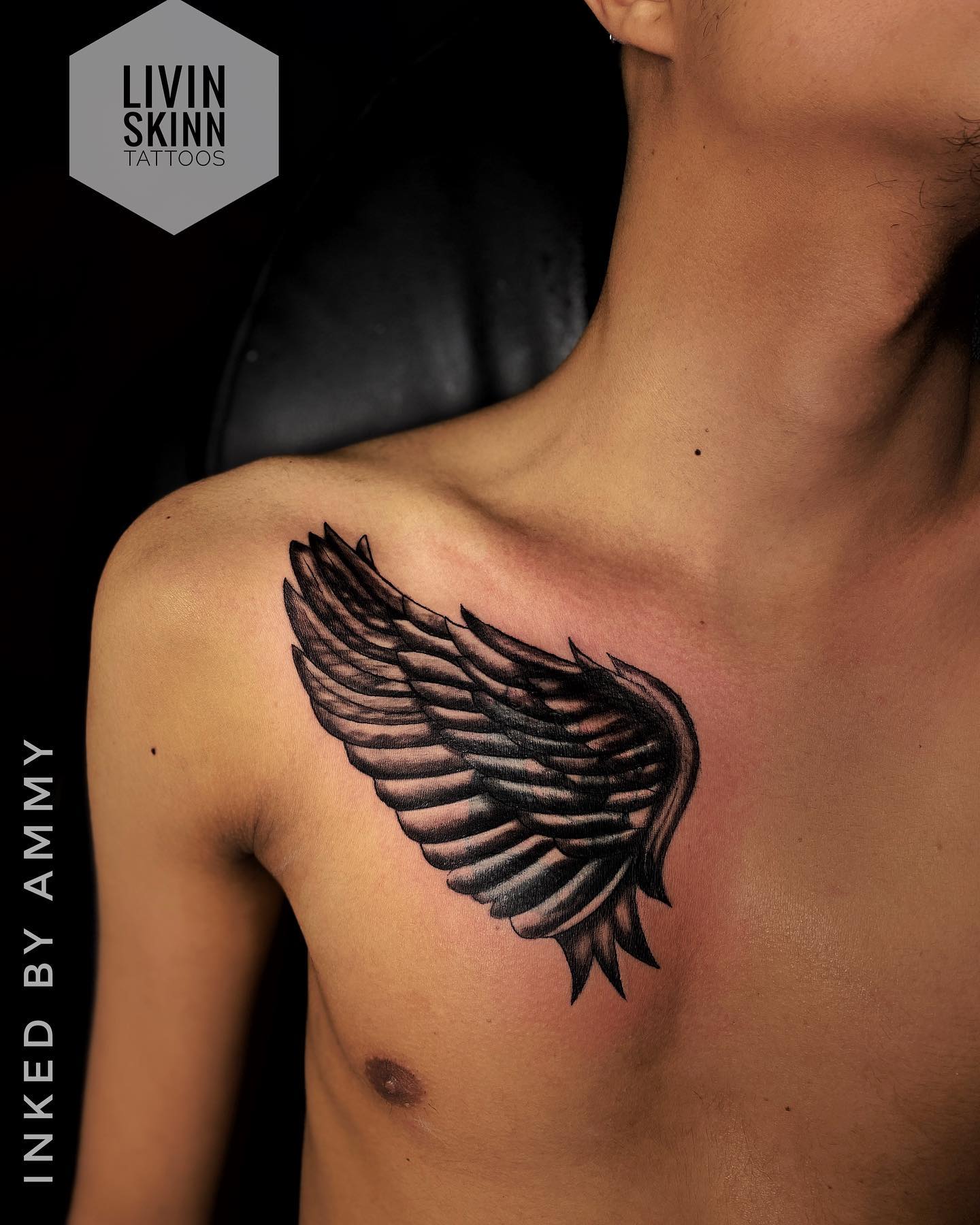 Angelic Blackwork Wing Across the Chest - Tattoos.com