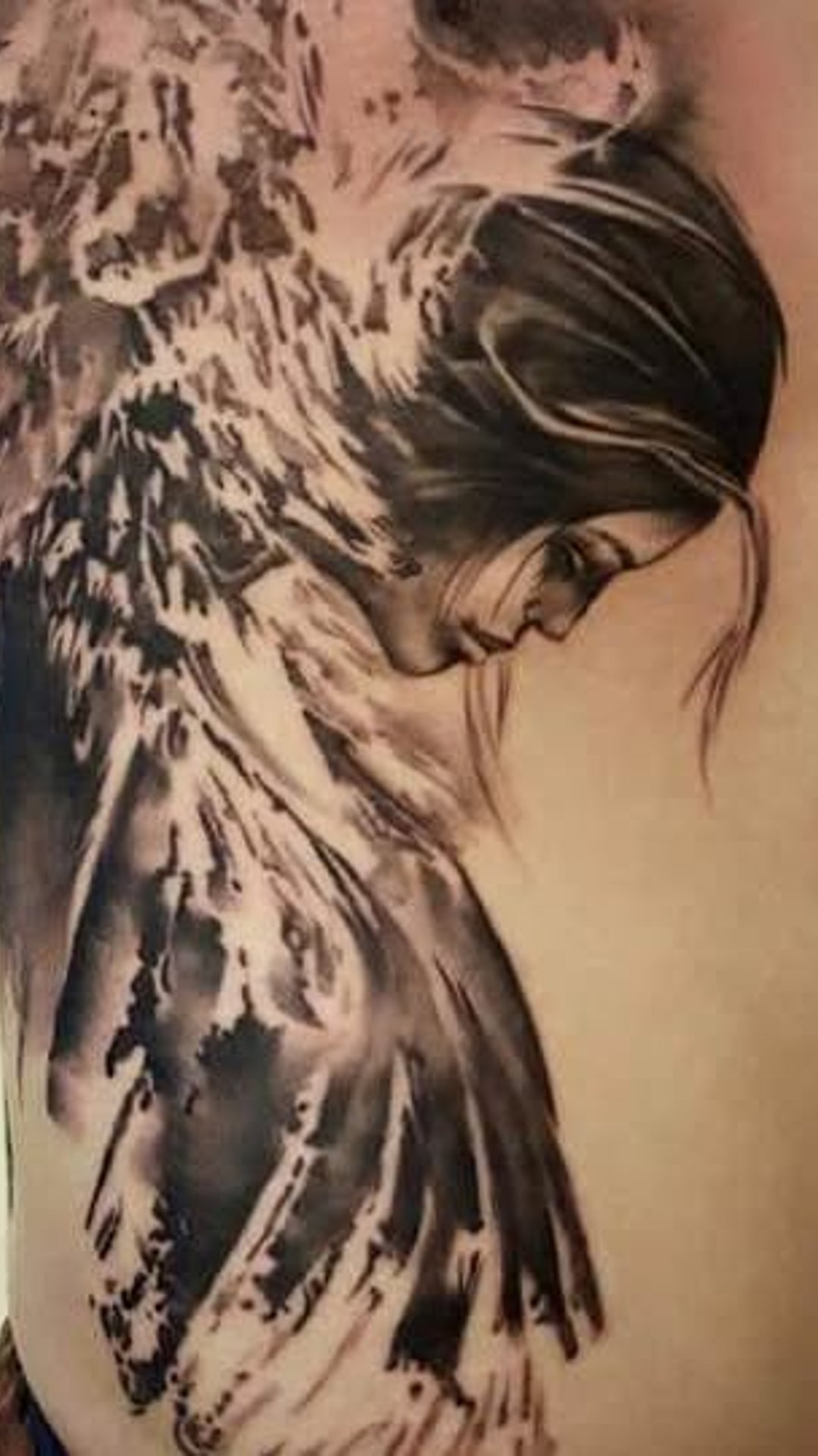 Fallen Angel Rib Portrait - Tattoos.com