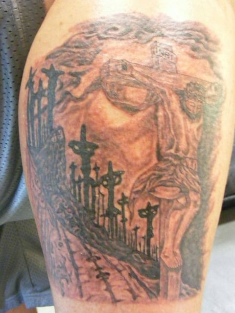 Tatuajes de Religiosos en Bíceps