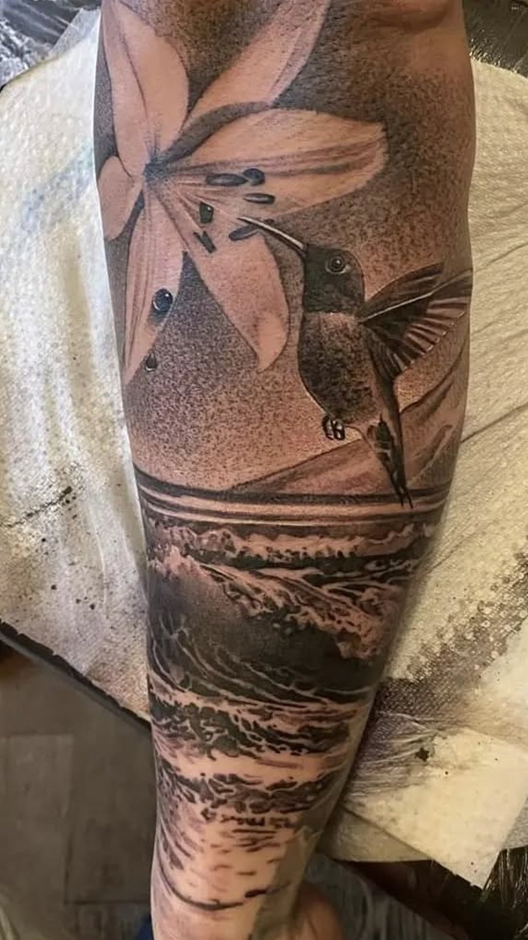 Hummingbird and Lily over Ocean Waves - Tattoos.com