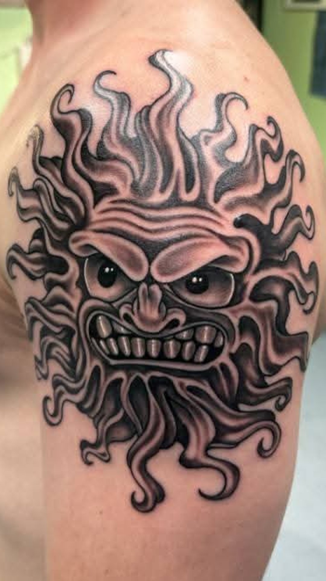Raging Sun Face - Tattoos.com